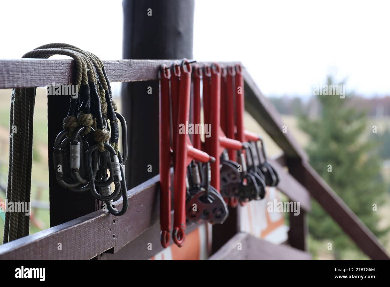 large metal locking carabiners with rope, climbing gear hanging on the ...
