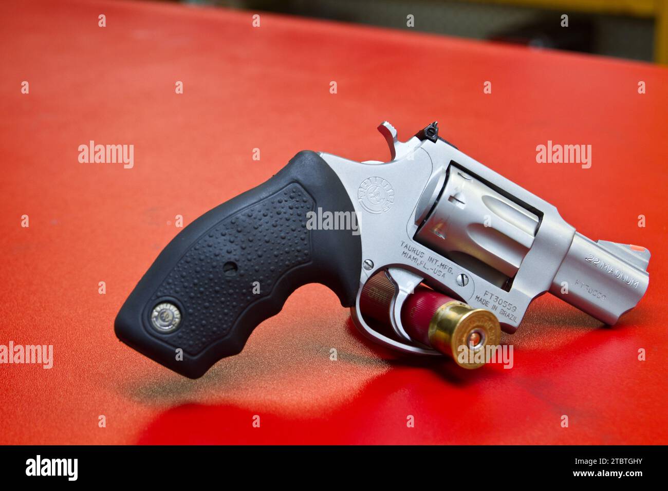 Close-Up of Loaded .22 Magnum Revolver on Red Surface Stock Photo - Alamy