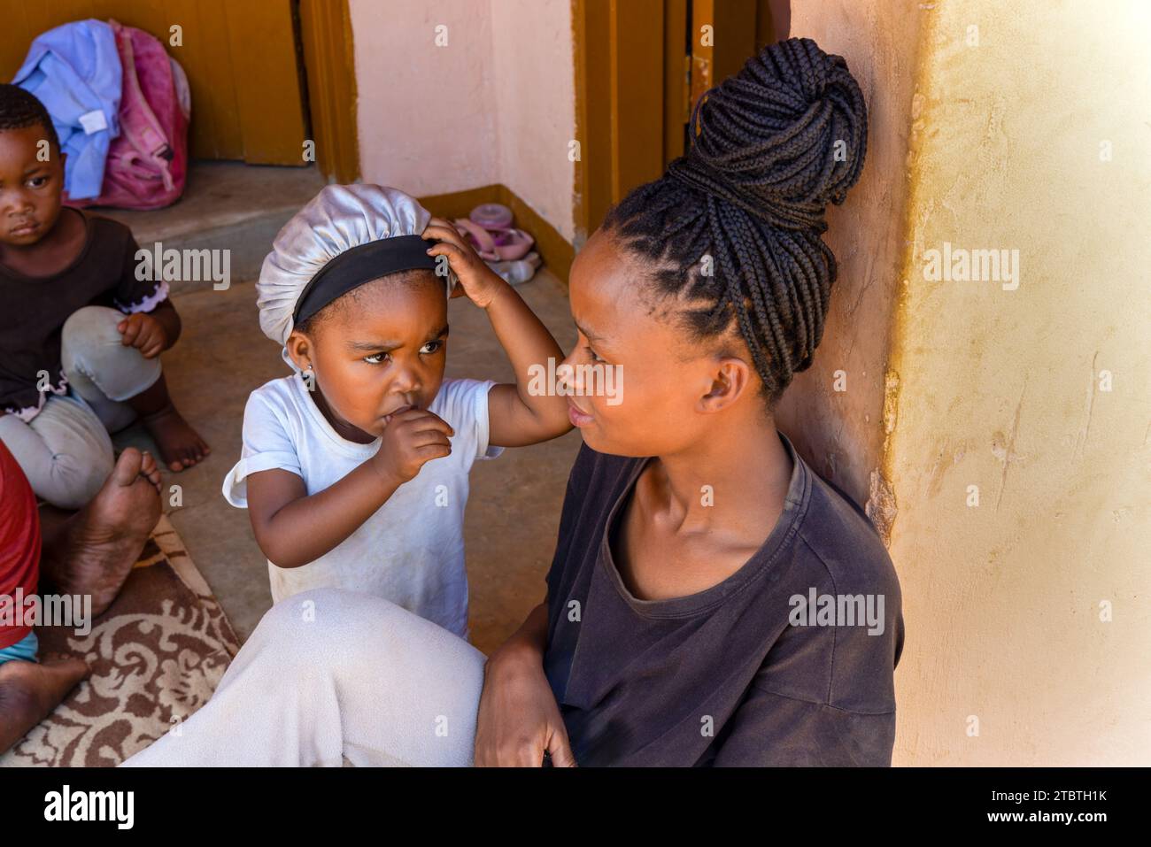 Girl scratching back toddler hi-res stock photography and images - Alamy