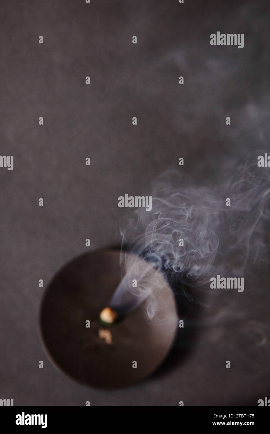 Meditative Glow of Incense Ember with Rising Smoke Patterns Stock Photo ...