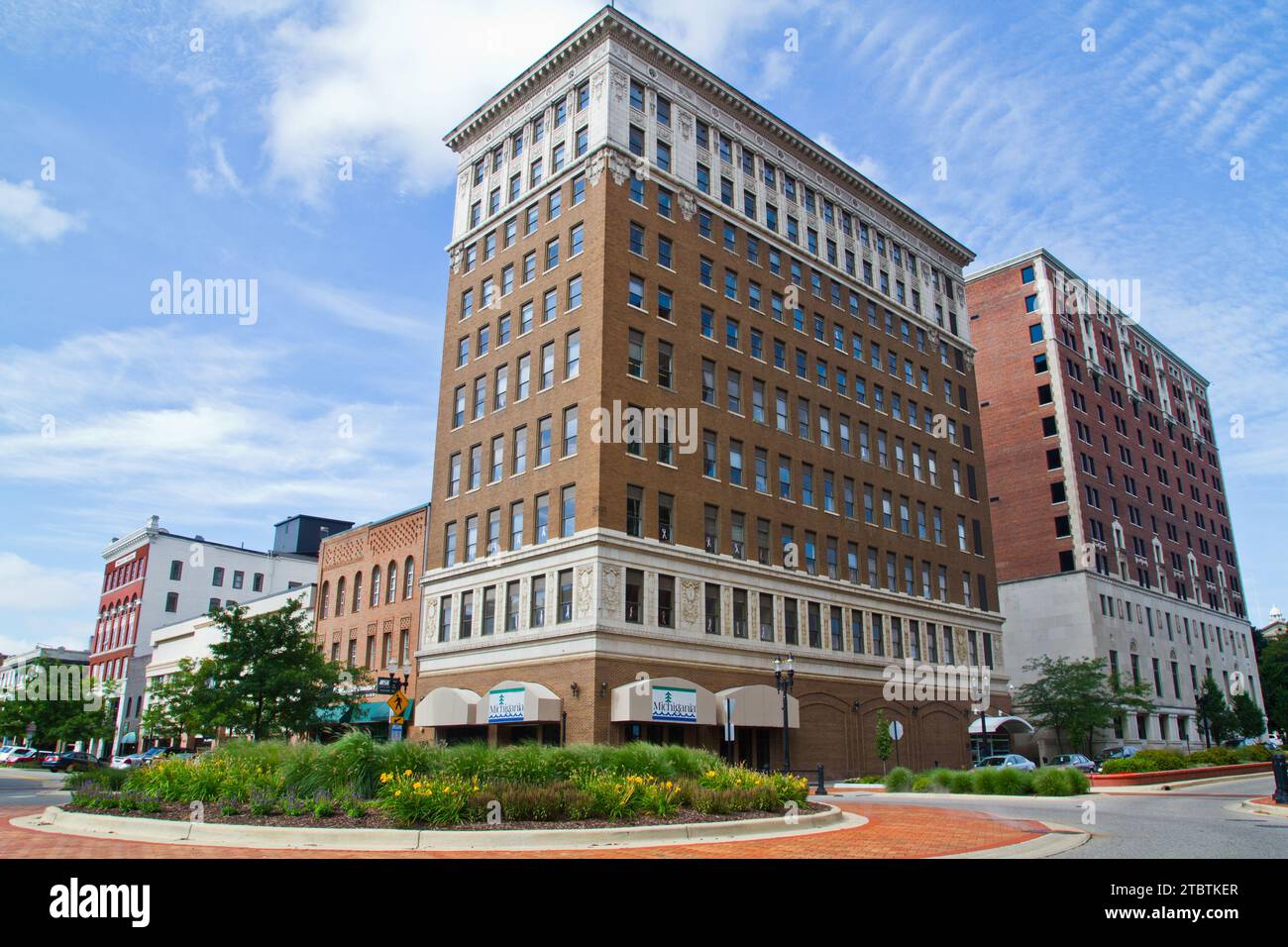 Bright Day View of Historic Brick Building and Urban Garden in Lansing ...