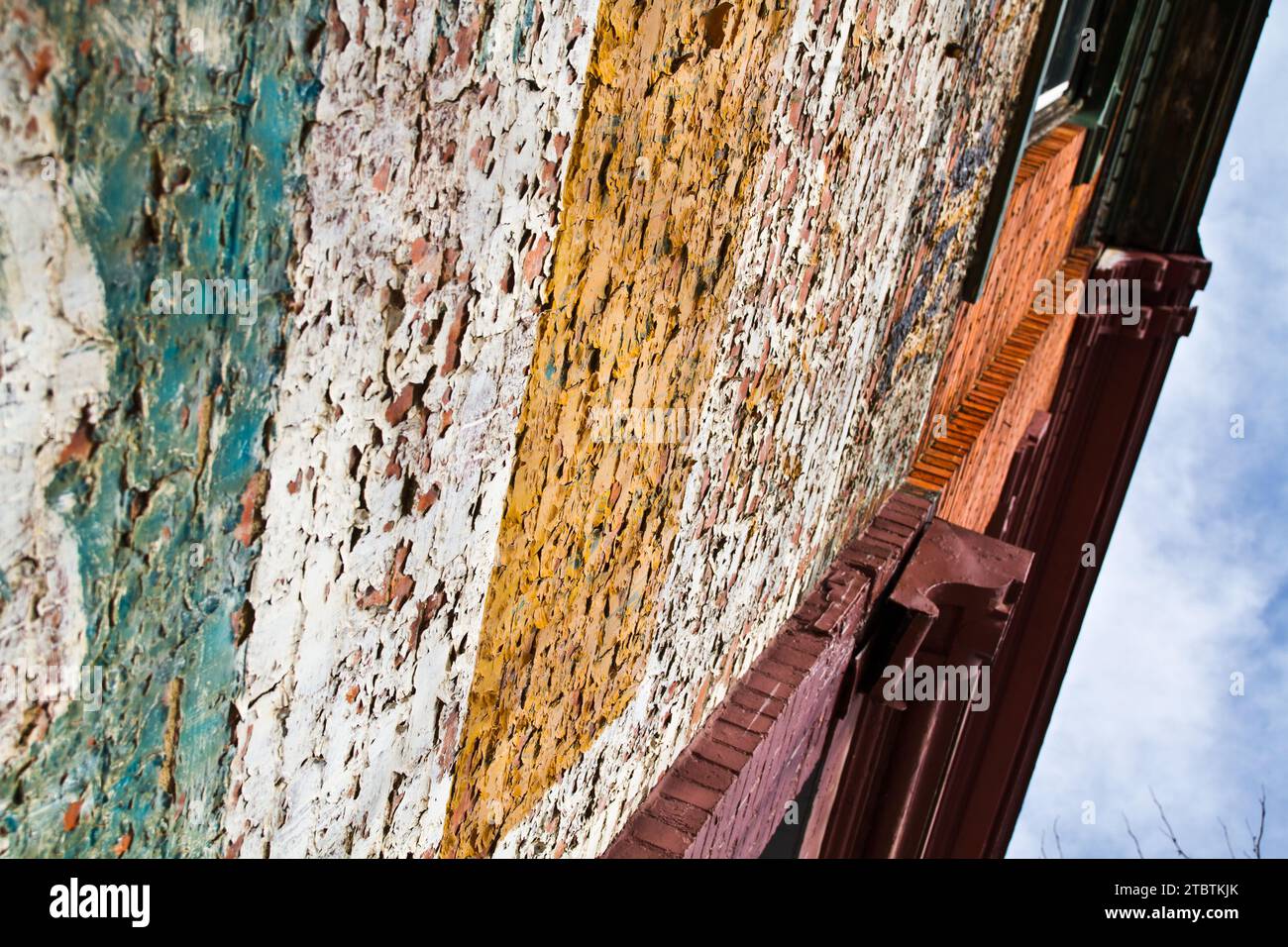 Upward View of Weathered Brickwork and Peeling Paint on Historic Urban ...