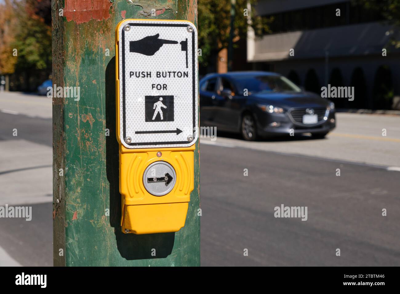 Pedestrian Push call button, with blurred car in background Stock Photo ...