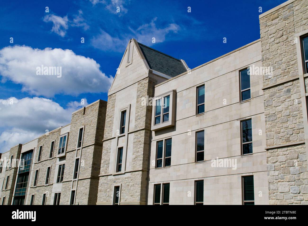 Modern Stone Building with Dark Windows under Blue Sky, Bloomington ...
