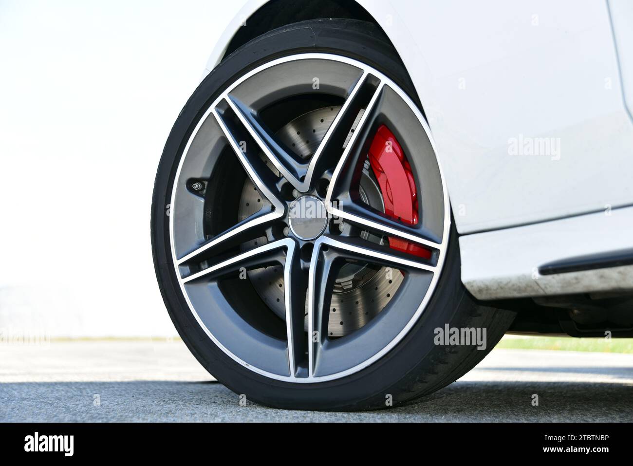 Aluminum car wheel with a tire on a sports car Stock Photo - Alamy