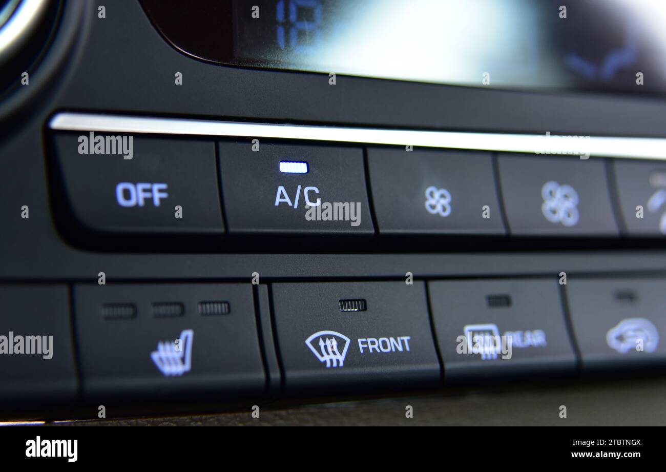 Buttons for activating the air conditioners on the dashboard passenger ...