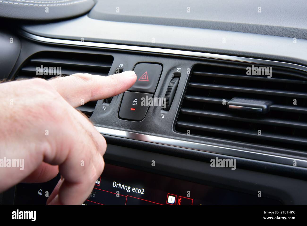 man pressing car hazard warning button Stock Photo - Alamy