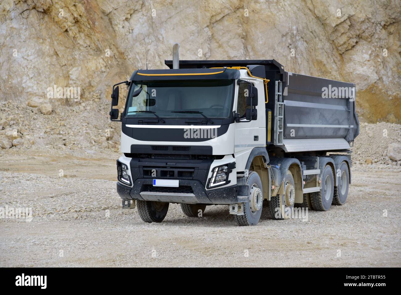 Big dump truck at work in the quarry. A truck for transporting stone or ...