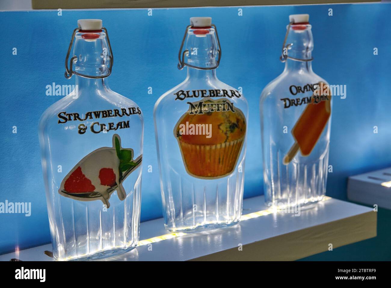 Flavor Themed Vape Decorative Glass Bottles on Illuminated Shelf Stock ...