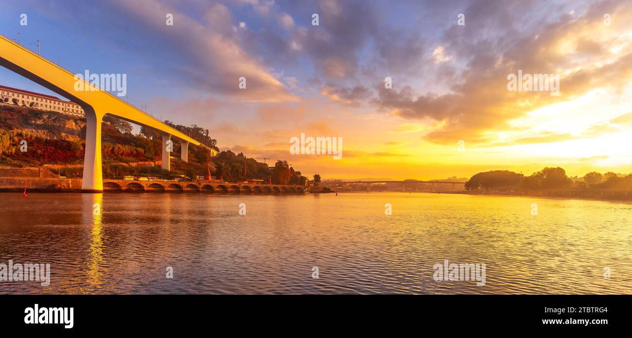 Brilliant orange sunset over the River Douro and the Sao Joao and ...