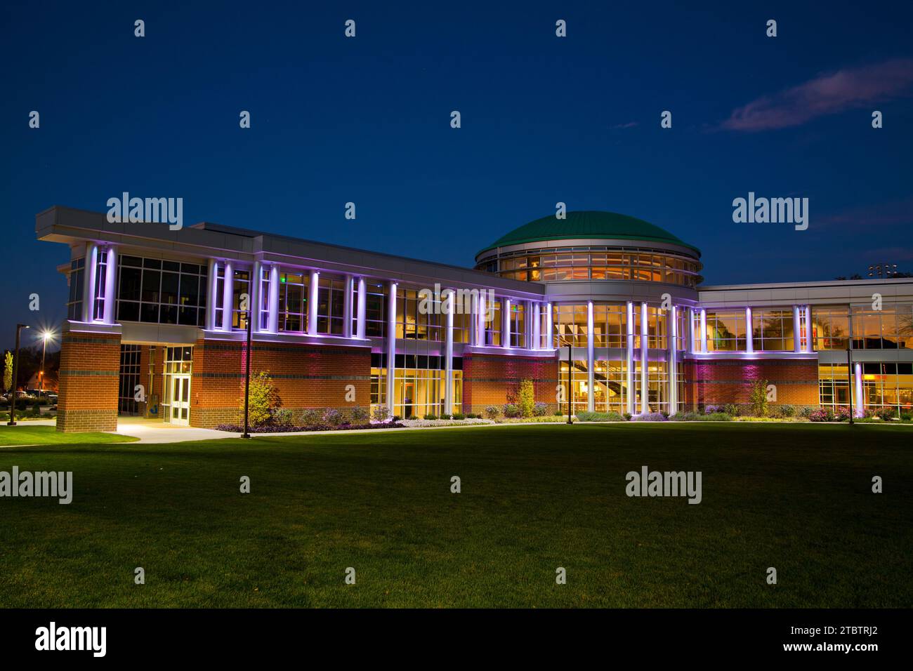 Twilight Glow on Modern Brick and Glass Building with Green Dome ...