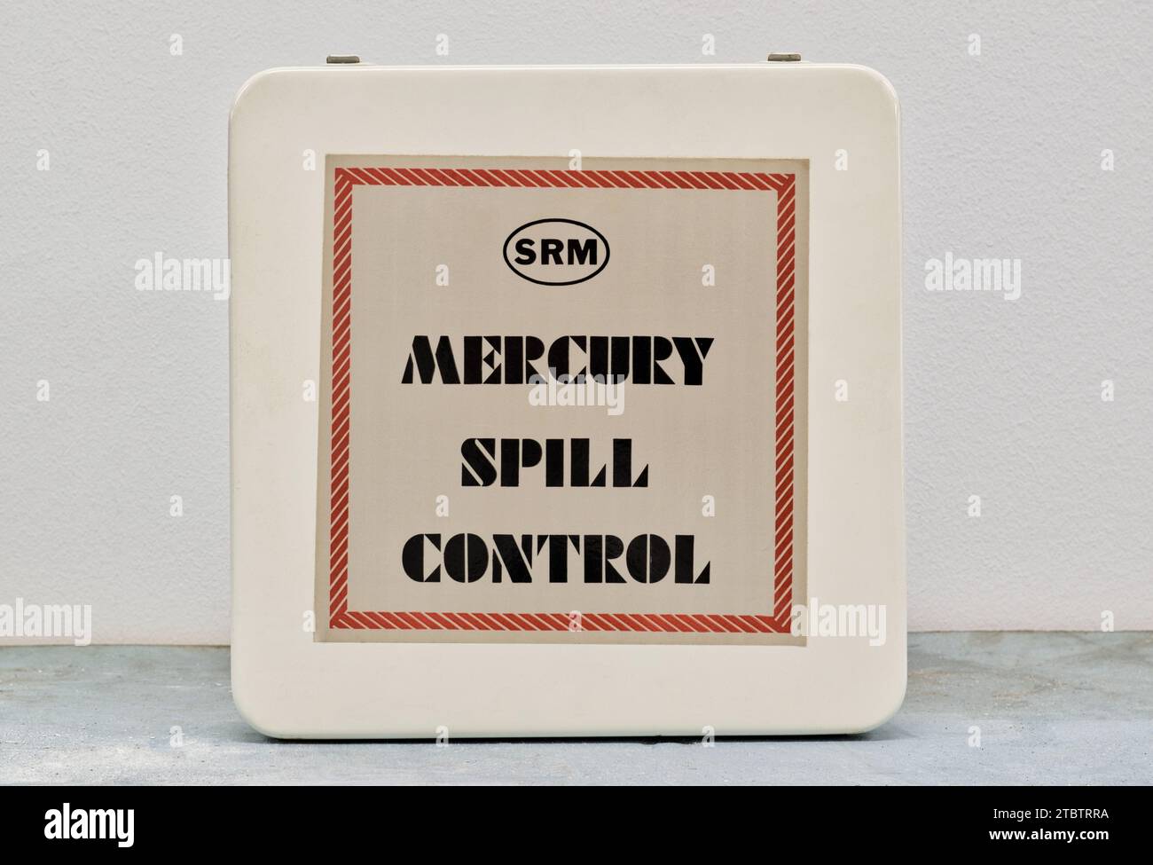 Closed Mercury spill control kit box standing upright centered on a ...