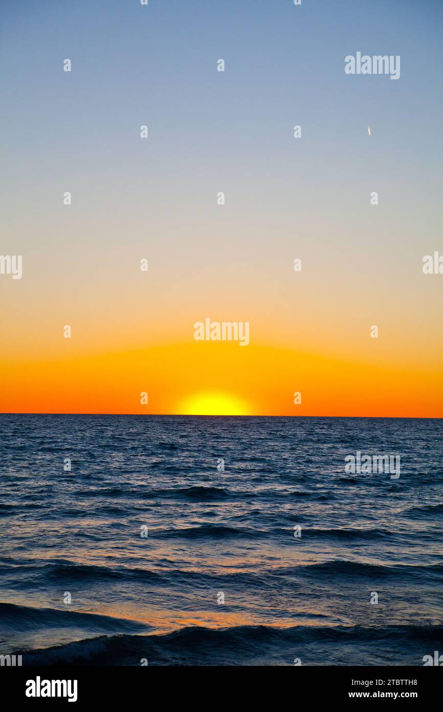 Serene Sunset Over Lake Michigan with Moon Glimpse Stock Photo - Alamy