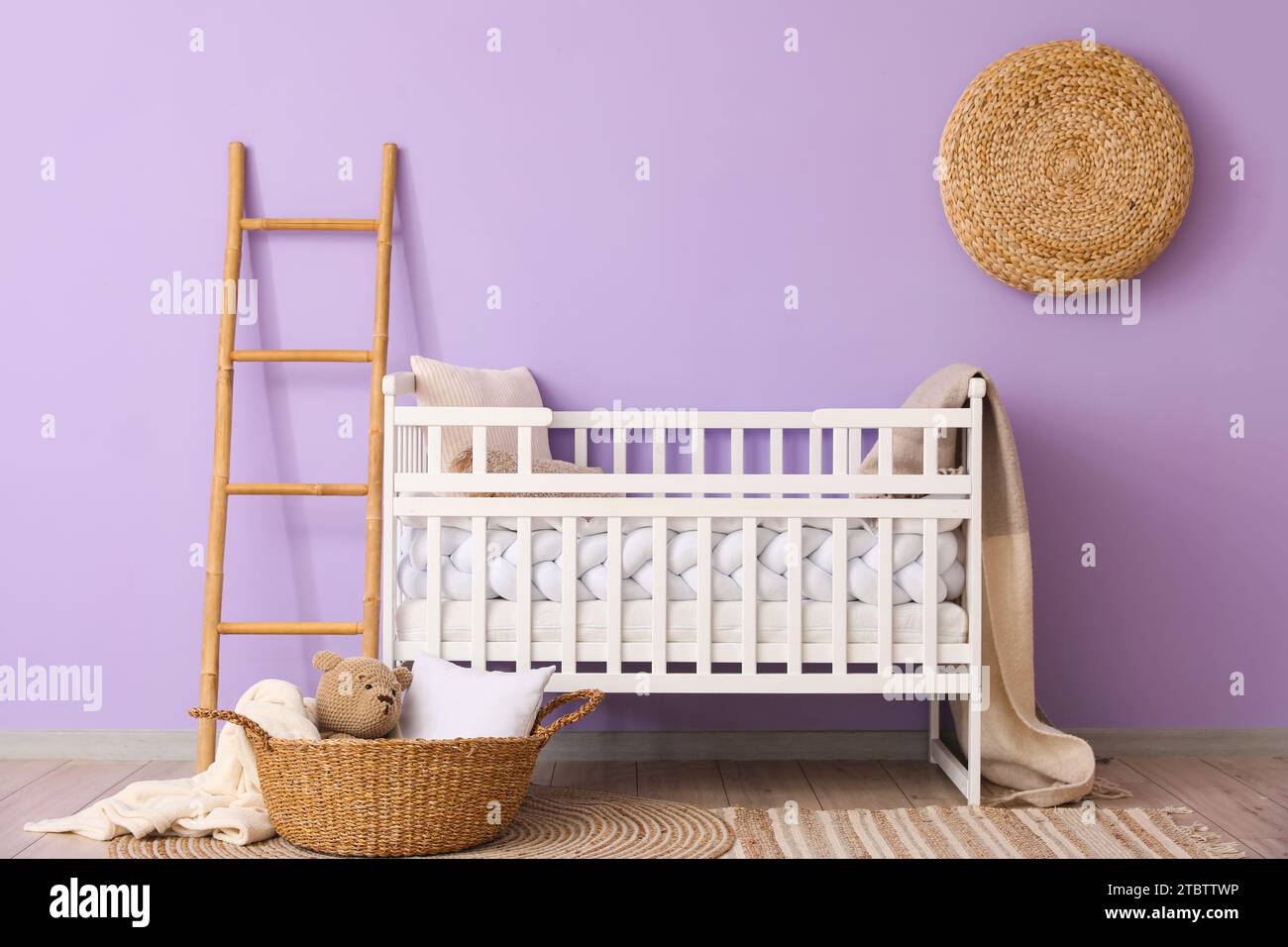 Interior of children's room with crib, ladder and basket Stock Photo ...
