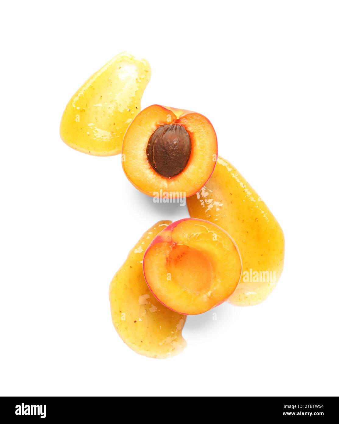 Sweet apricot and smear of jam on white background Stock Photo - Alamy