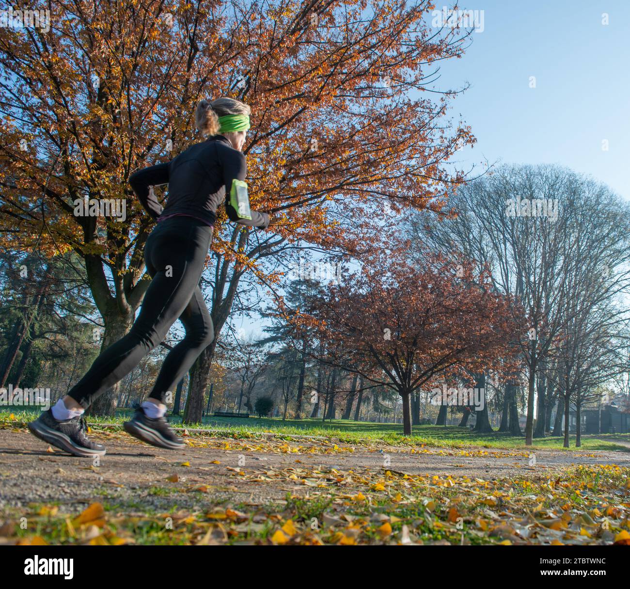 Girl running in the Ravizza park in Milan Stock Photo - Alamy