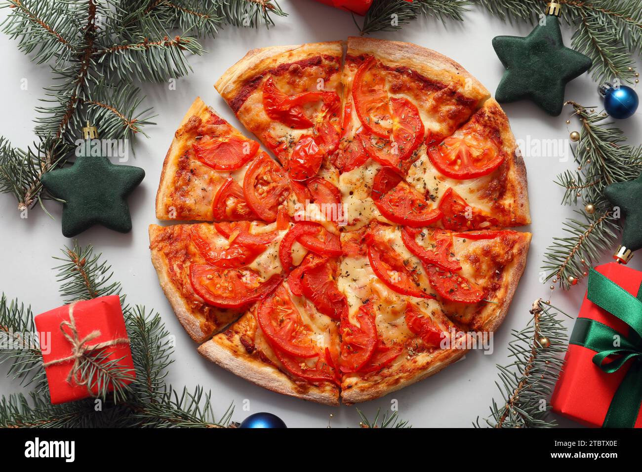 Delicious pizza with Christmas decor on white background Stock Photo ...