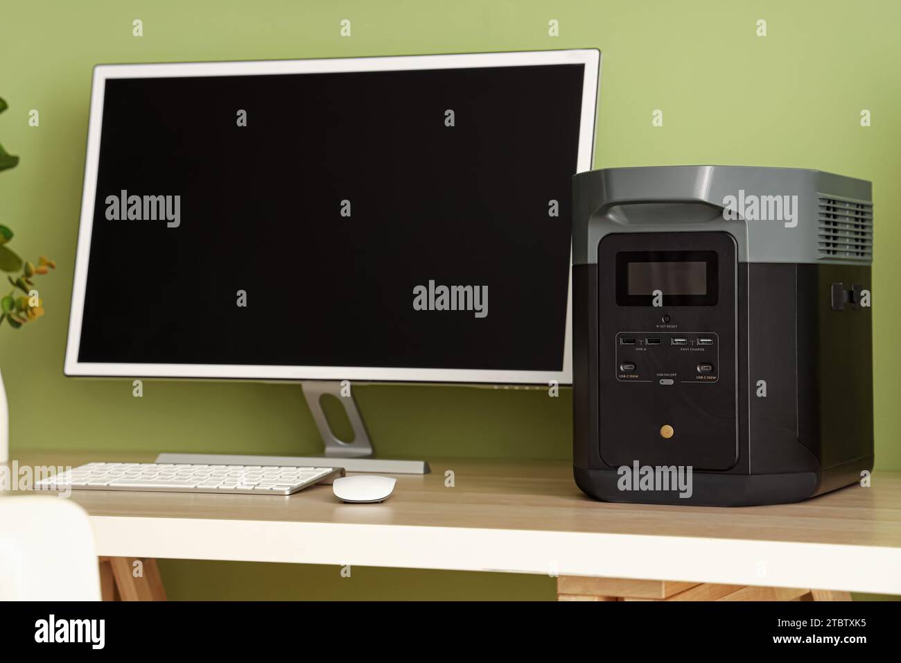 Workplace with computer and portable power station in office Stock ...