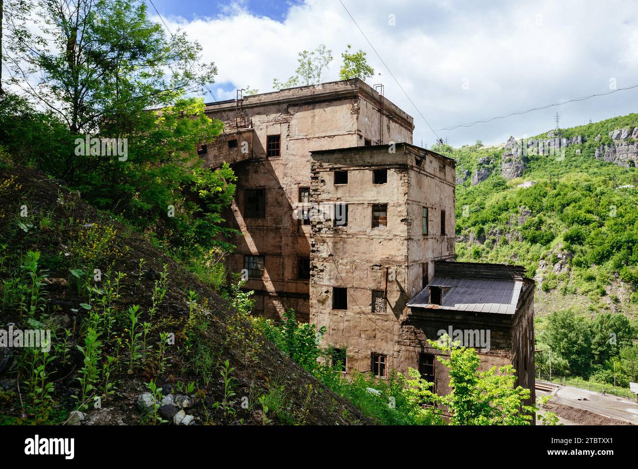 Old ruined overgrown industrial building in Chiatura, Georgia Stock ...