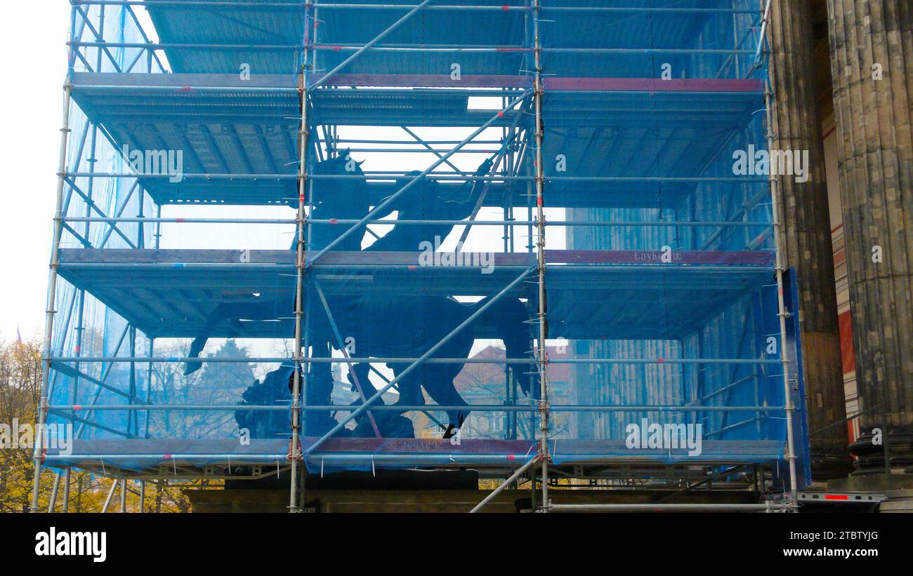 Lionfighter statue restoration behind scaffolding and blue netting in ...
