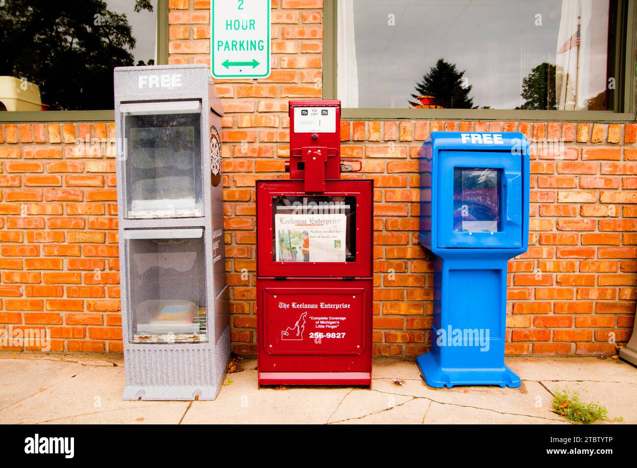 Daylight Scene of Newspaper Vending Machines on Vibrant Brick Wall in ...