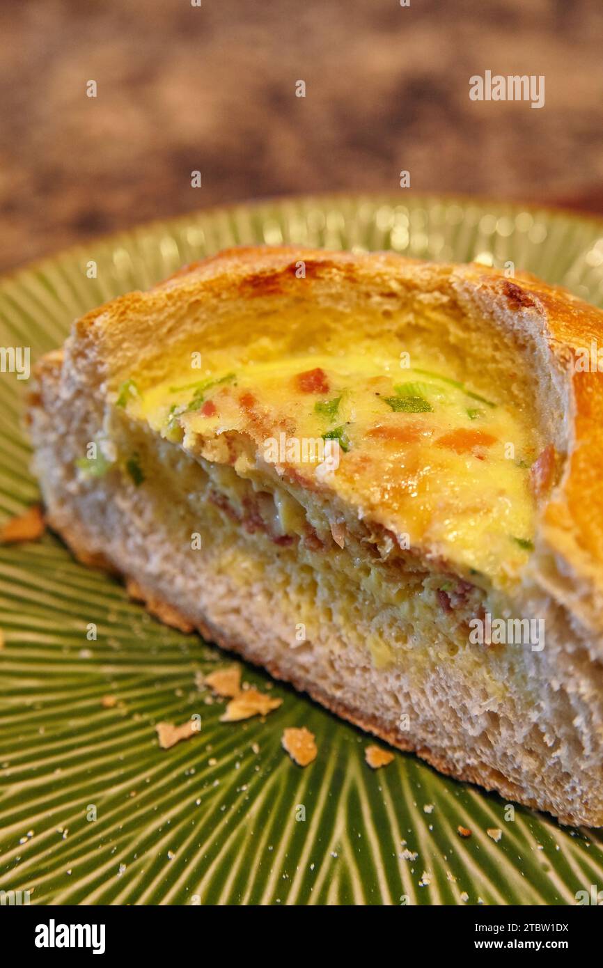 Freshly Baked Quiche Slice on Green Plate Close-Up Stock Photo - Alamy