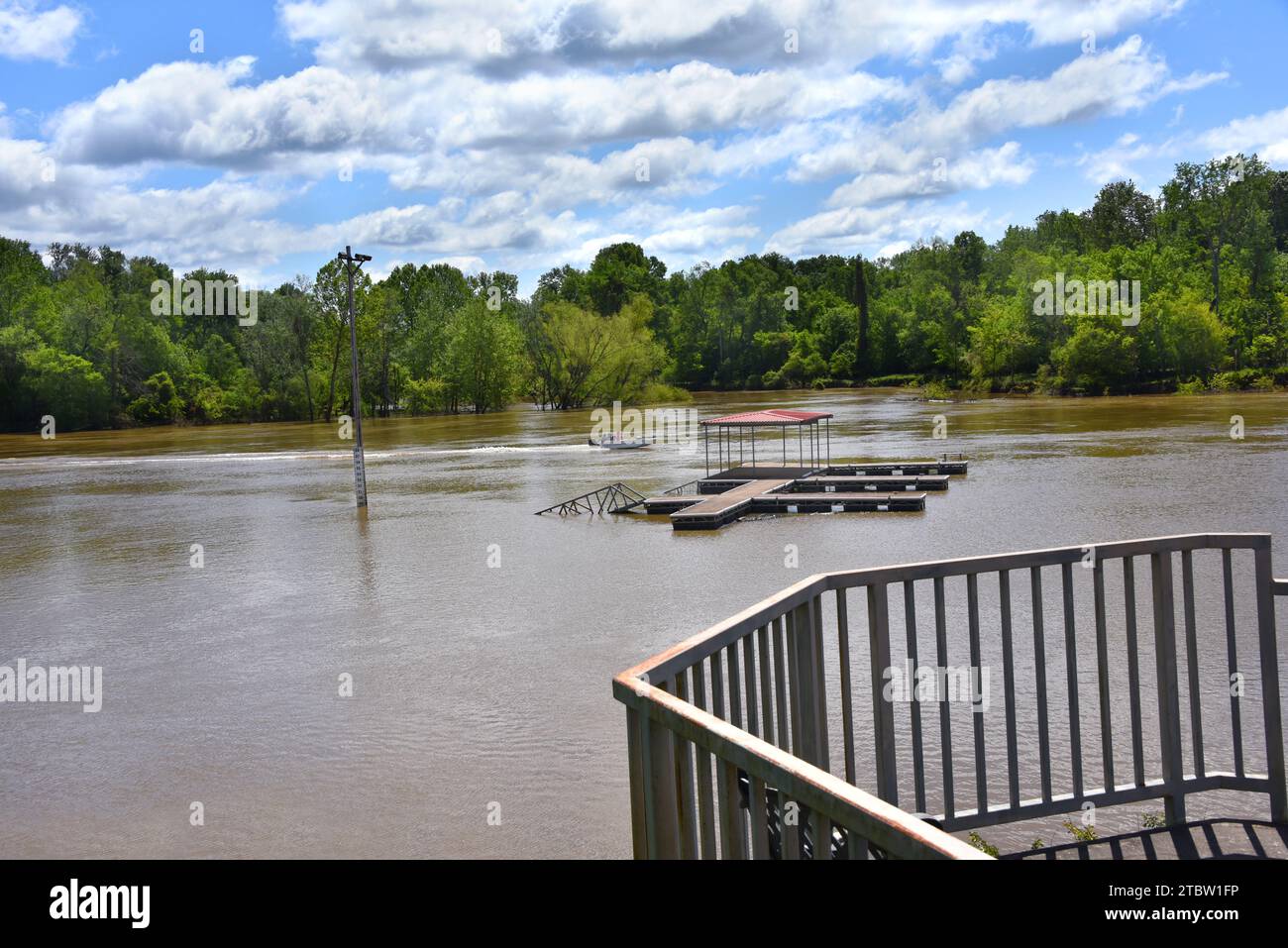 Tide mark shown on river gage shows almost 29 foot. Boat travels ...