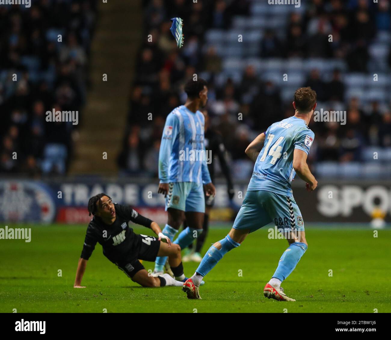 Ben Sheaf #14 of Coventry City throws Romelle Donovan #49 of Birmingham ...