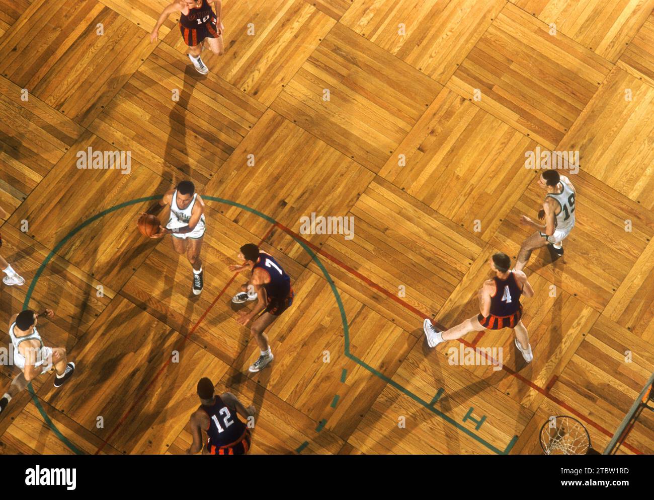 BOSTON, MA - DECEMBER 12: Bob Cousy #14 of the Boston Celtics looks to ...