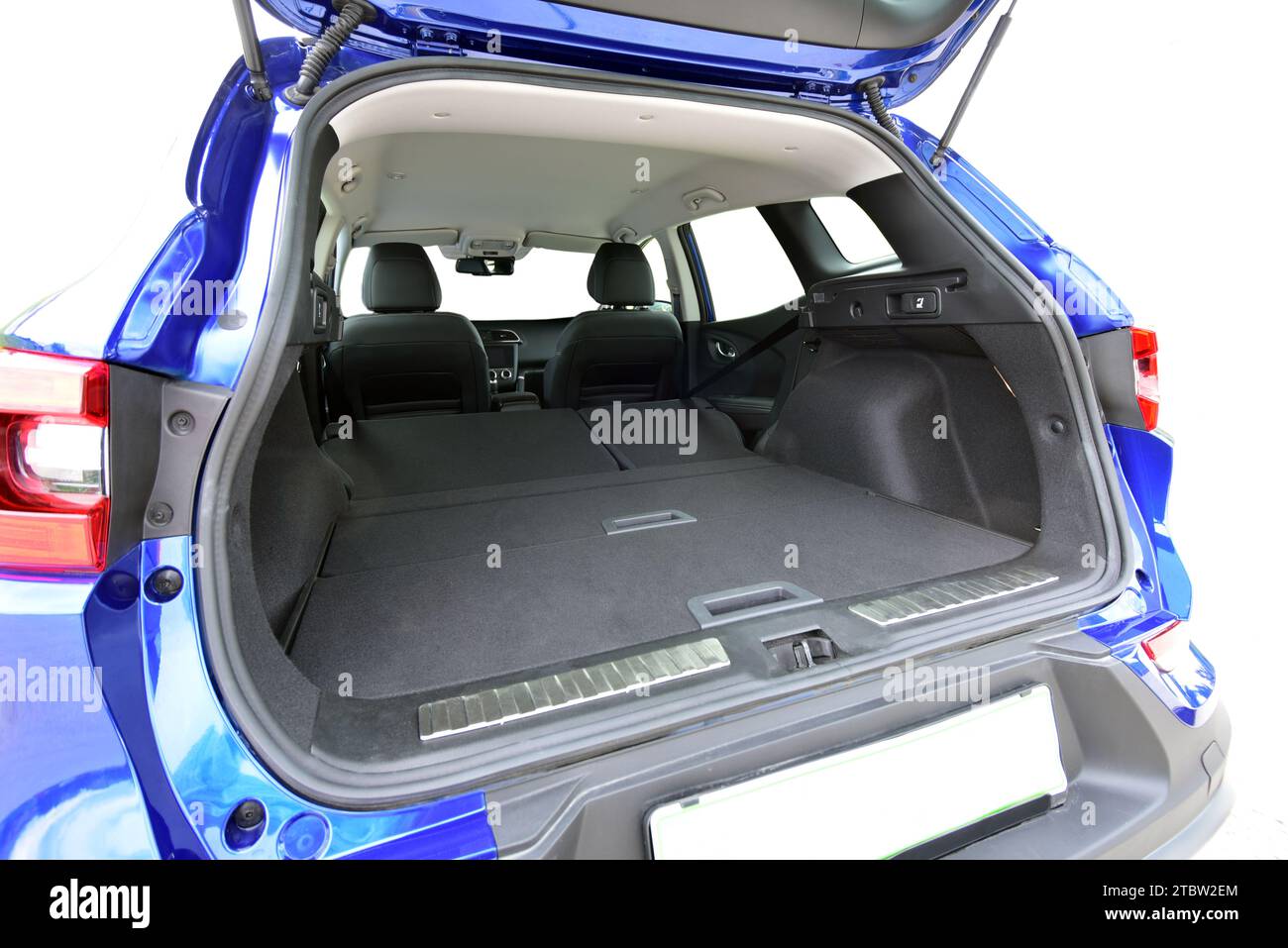 Empty trunk with rear seats folded of passenger car Stock Photo - Alamy