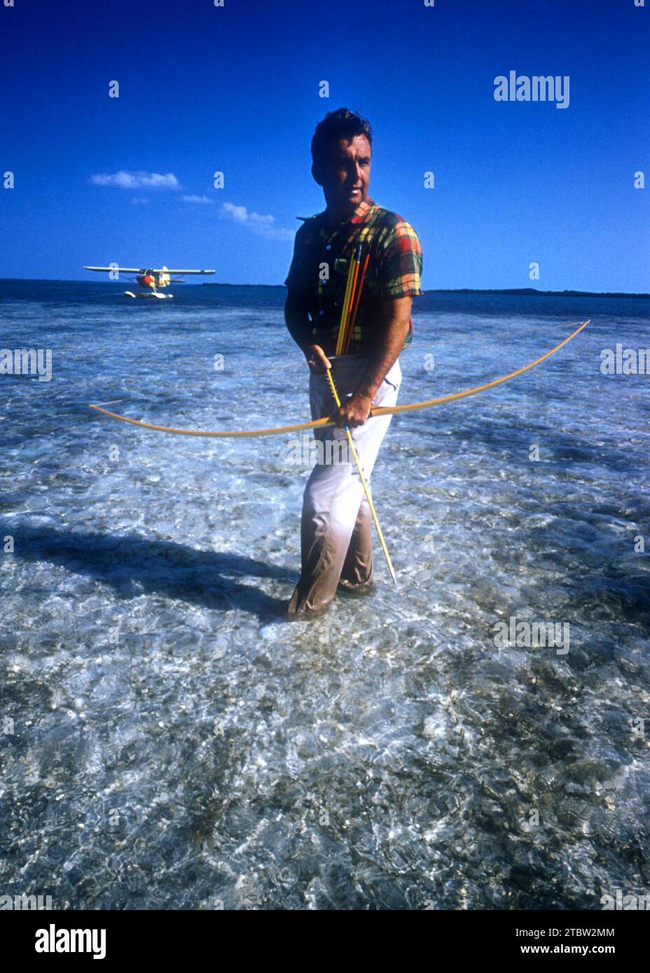 BAHAMAS - APRIL 7: Colyn Rees poses with his loaded bow and arrow while ...