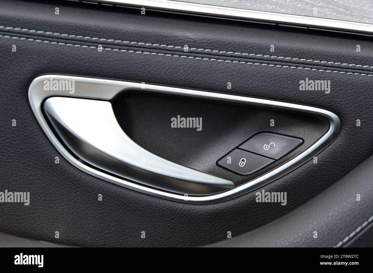 A handle to open on the inside of the car door Stock Photo - Alamy