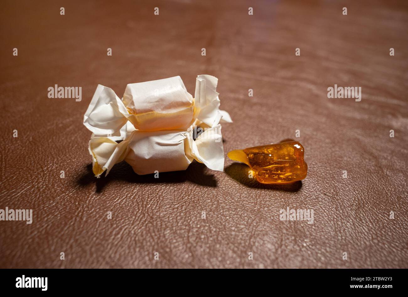 honey candies wrapped in white paper Stock Photo - Alamy