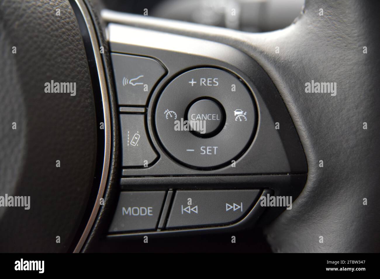 Steering wheel button with cruise control Stock Photo - Alamy