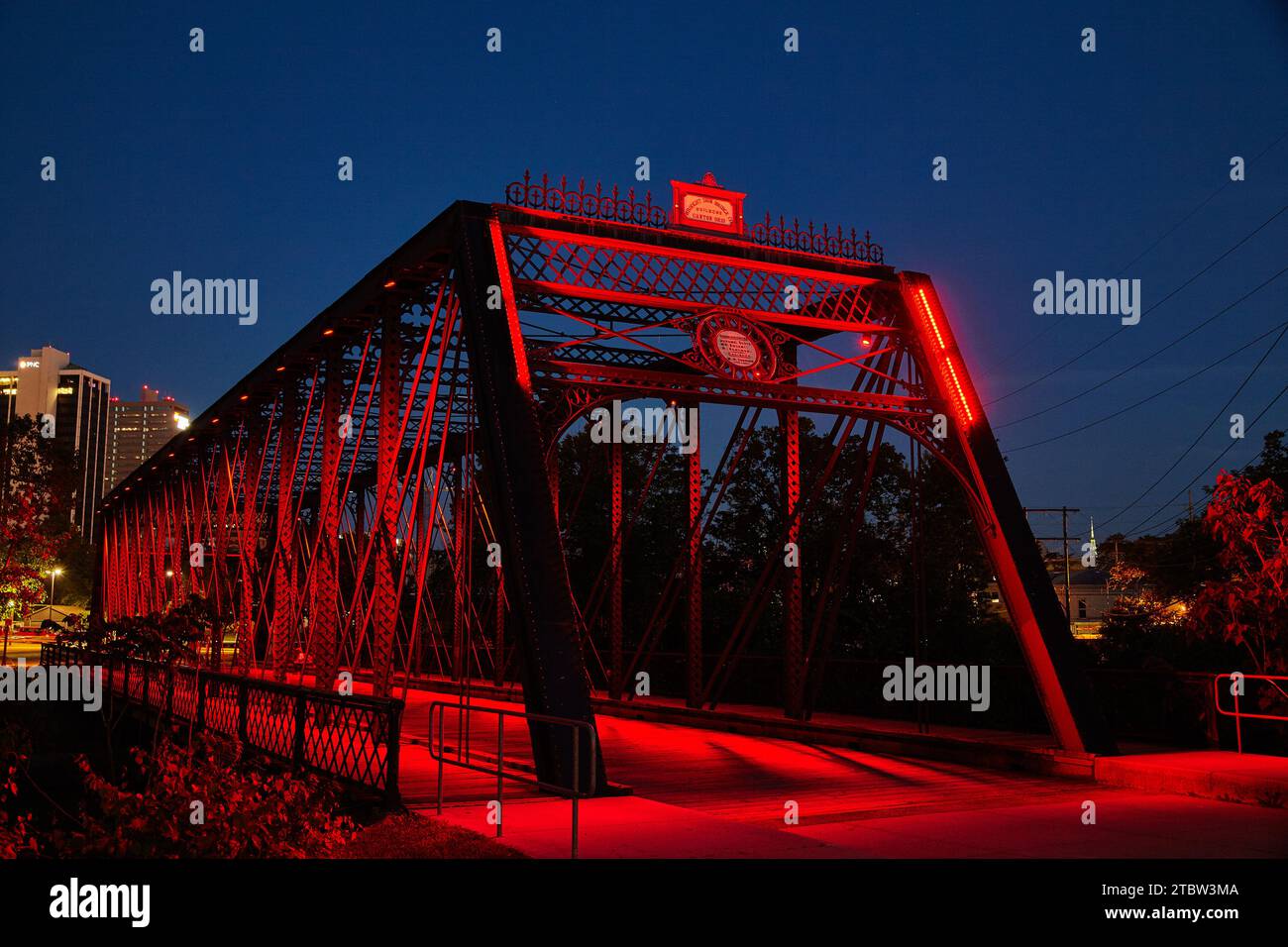 Red Illuminated Historic Steel Truss Bridge at Twilight in Urban Fort ...