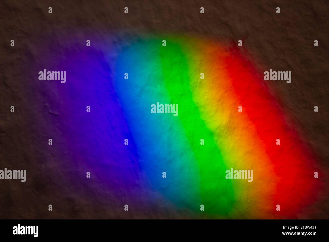 A vibrant and colorful shadow being cast in a dark environment Stock ...
