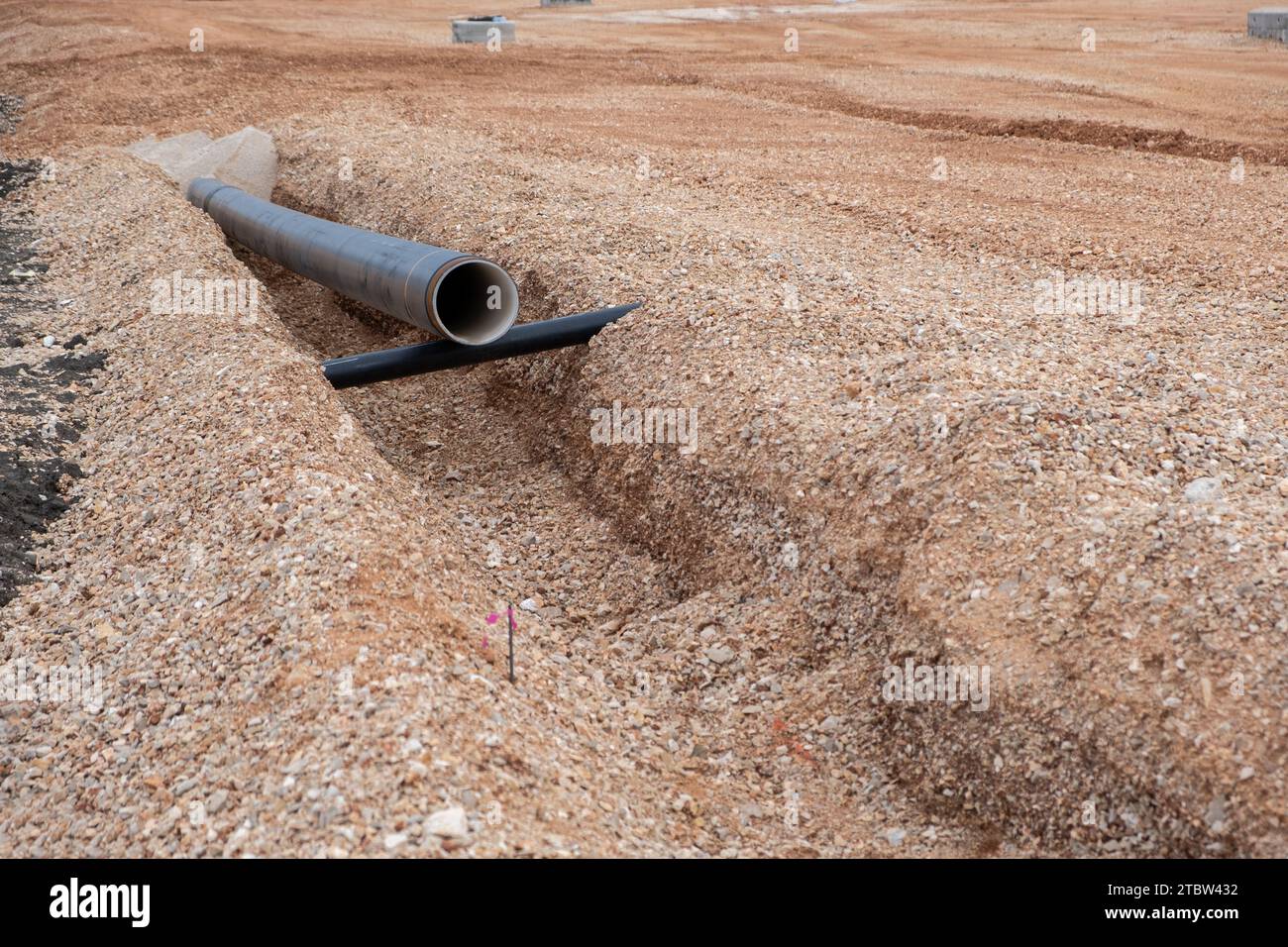 Laying sewer drainage pipe on constriction site. Digged New sanitary ...