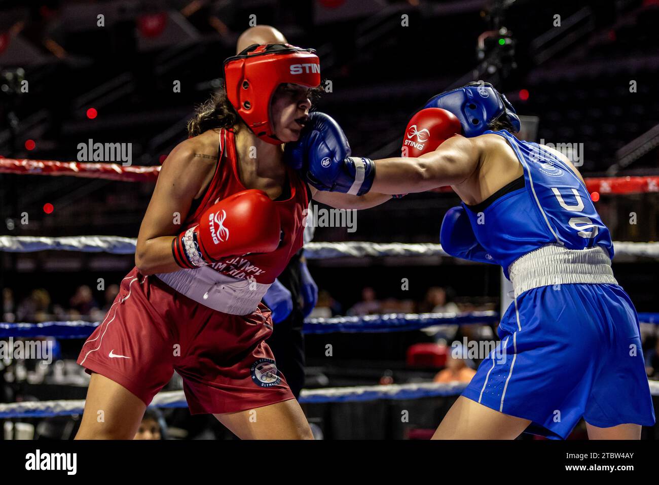 Nelda Ibarra (red) takes a jab from Emma Nayanet (blue) during the Olympic Boxing Trials ...