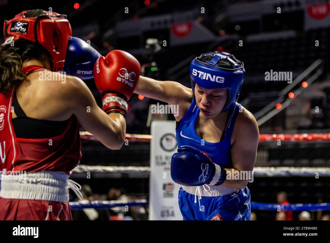 Nelda Ibarra (red) takes a jab from Emma Nayanet (blue) during the ...