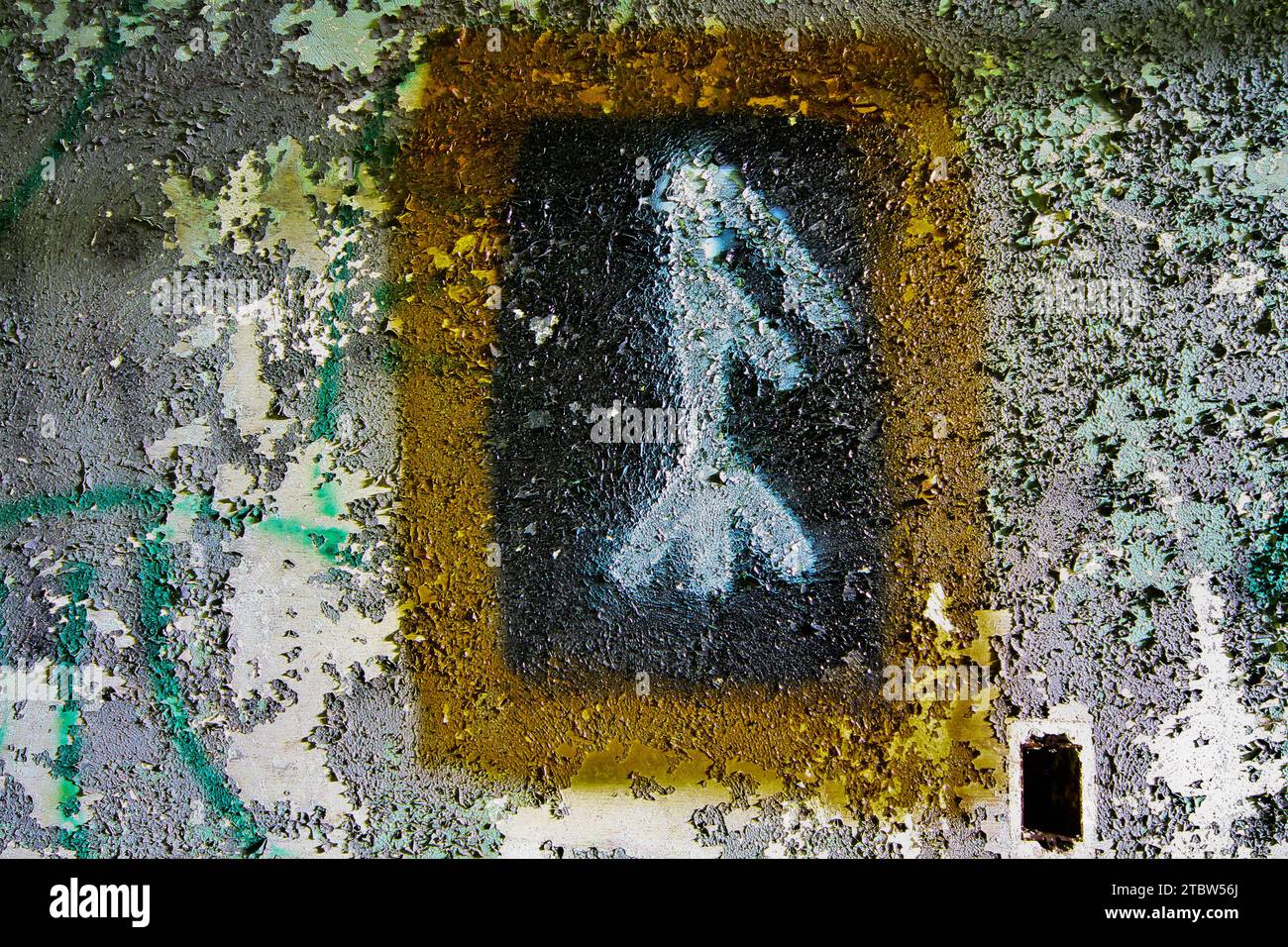 Decayed Pedestrian Symbol on Weathered Urban Wall Stock Photo - Alamy