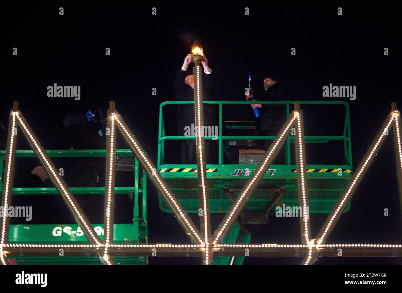 New York, New York, USA. 7th Dec, 2023. Rabbi Shmuel M. Butman lights ...