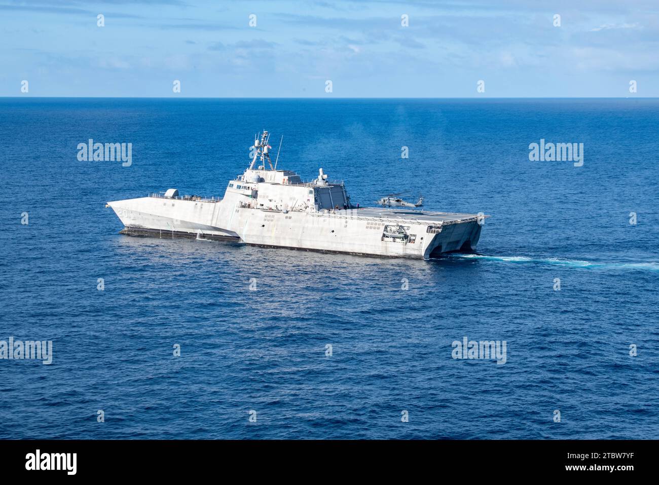 A 920th Rescue Wing HH-60G Pave Hawk helicopter refuels on USS Cincinnati (LCS-20), a littoral ...