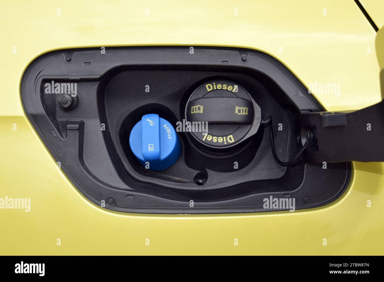 Diesel fuel tank cap and AdBlue fluid tank cap Stock Photo - Alamy