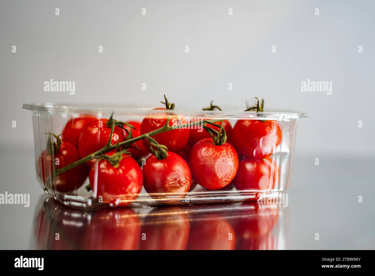 Stale tomatoes in a plastic box Stock Photo - Alamy