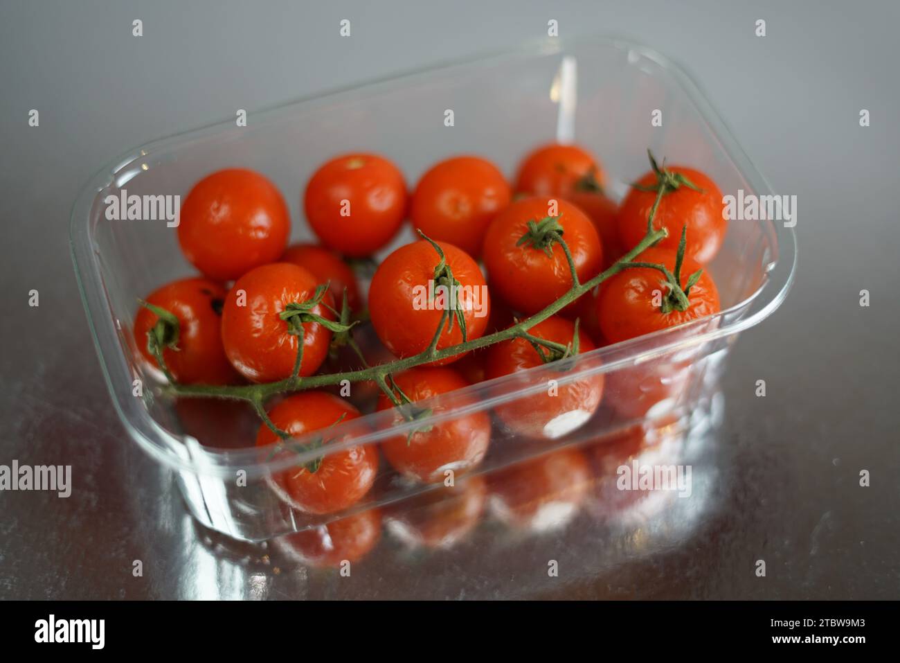 Stale tomstoes in a plastic box Stock Photo - Alamy
