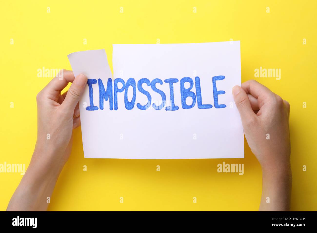 Motivation concept. Woman making word Possible from Impossible by ...