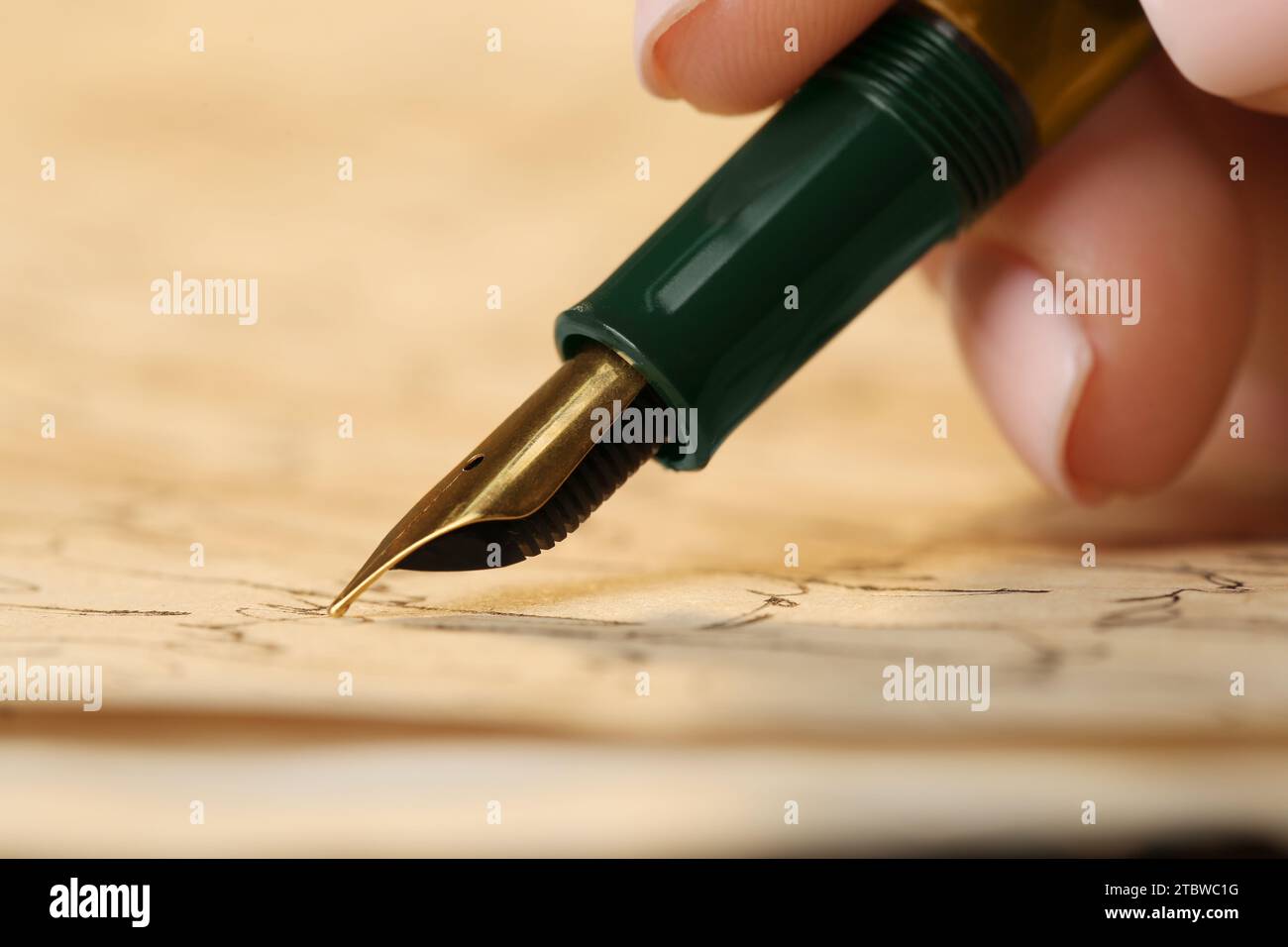 Woman writing letter with fountain pen, closeup Stock Photo - Alamy