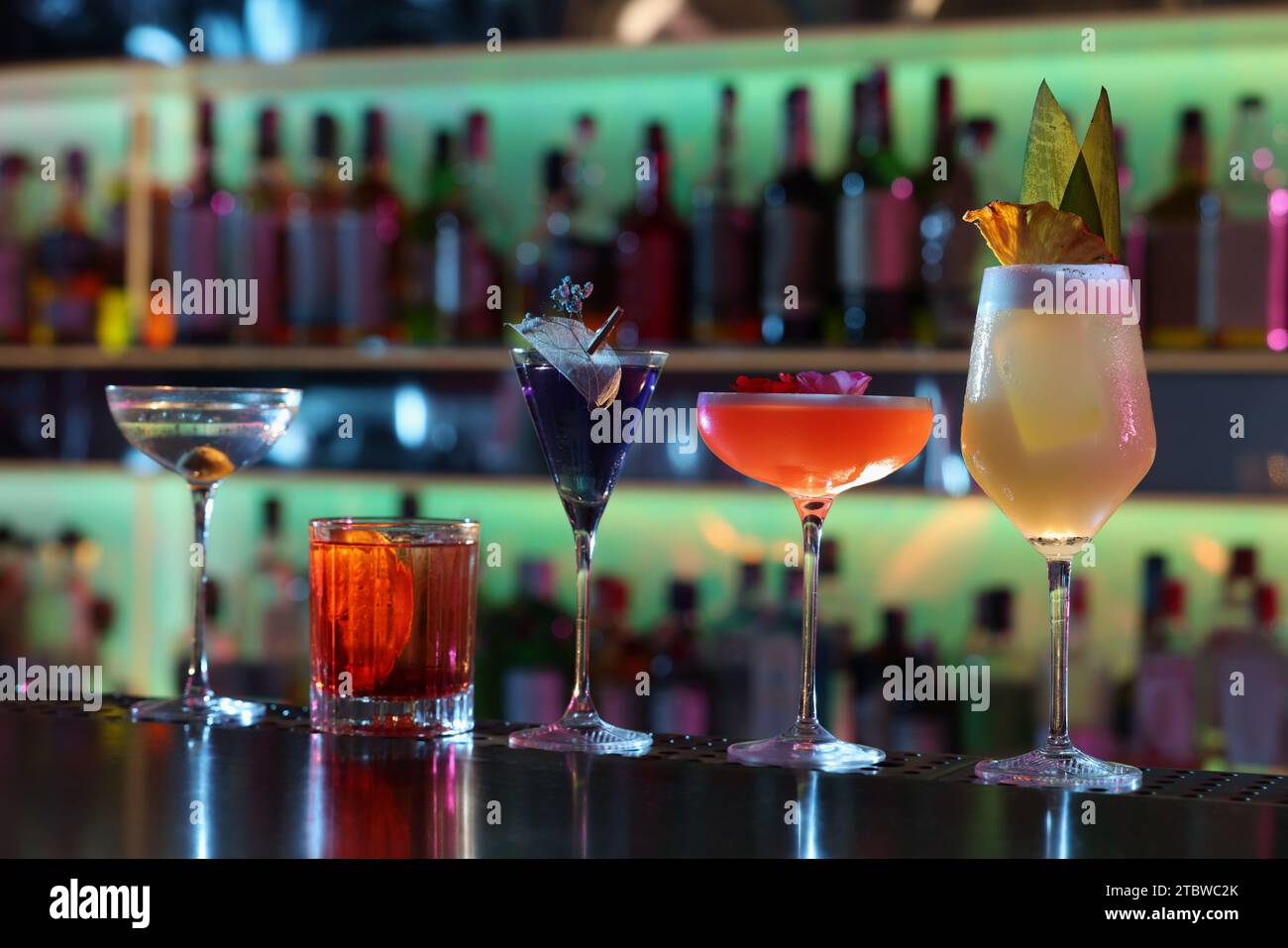 Different fresh alcoholic cocktails on counter in bar Stock Photo - Alamy
