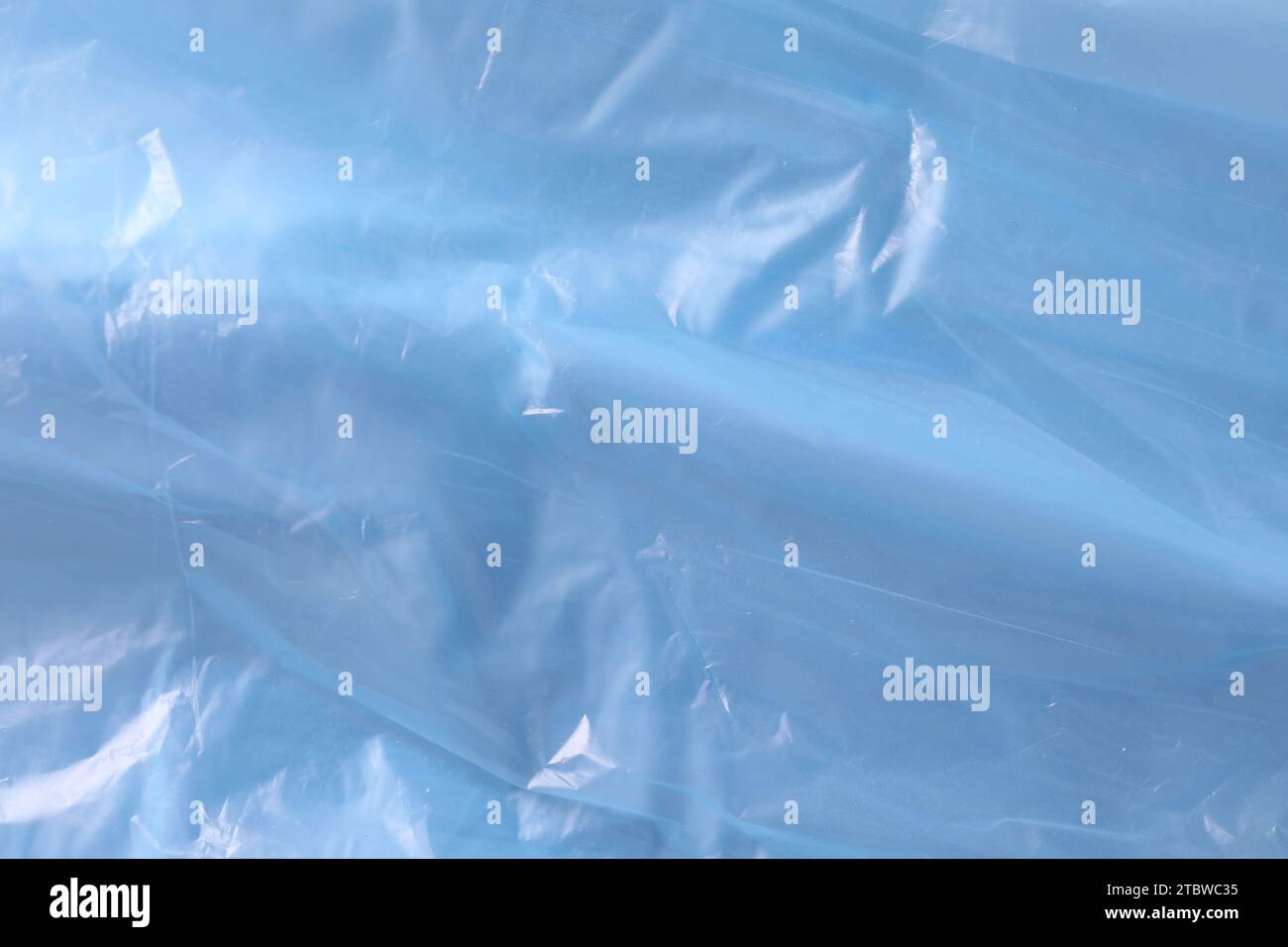 Texture of light blue plastic bag as background, closeup Stock Photo ...