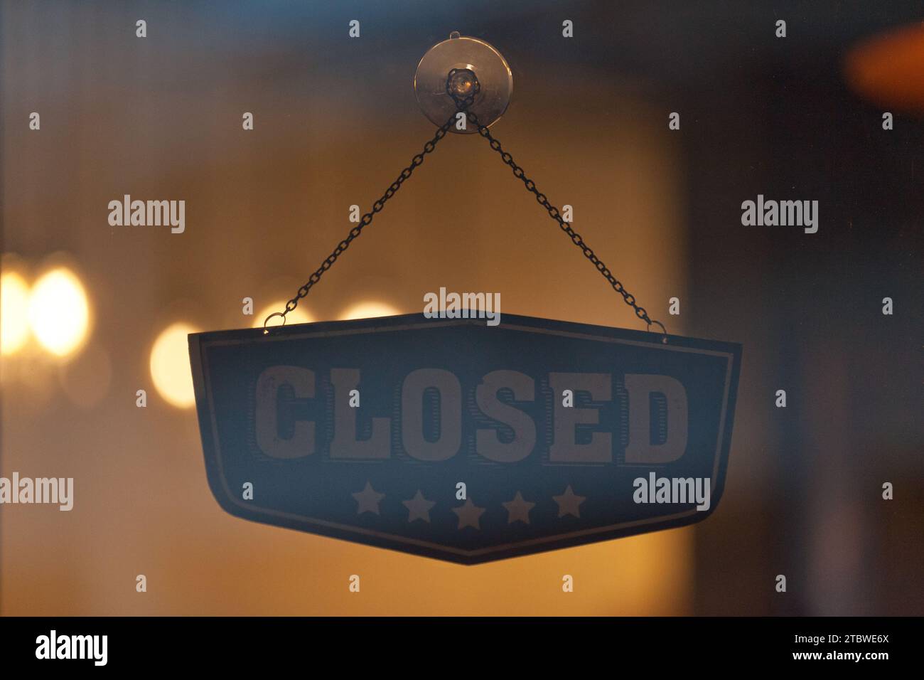 Old fashioned sign in the window of a shop saying in "Closed Stock ...